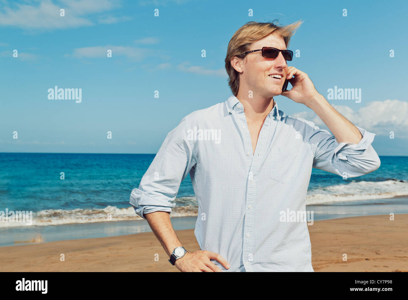 Business man calling by cell phone on the beach Stock Photo - Alamy