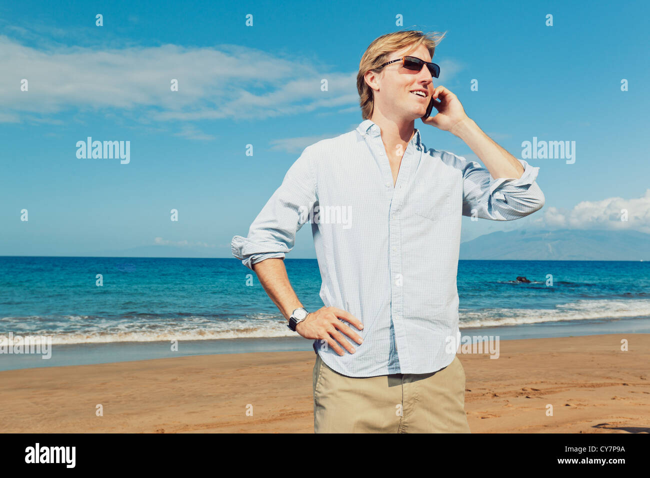 Business man calling by cell phone on the beach Stock Photo - Alamy