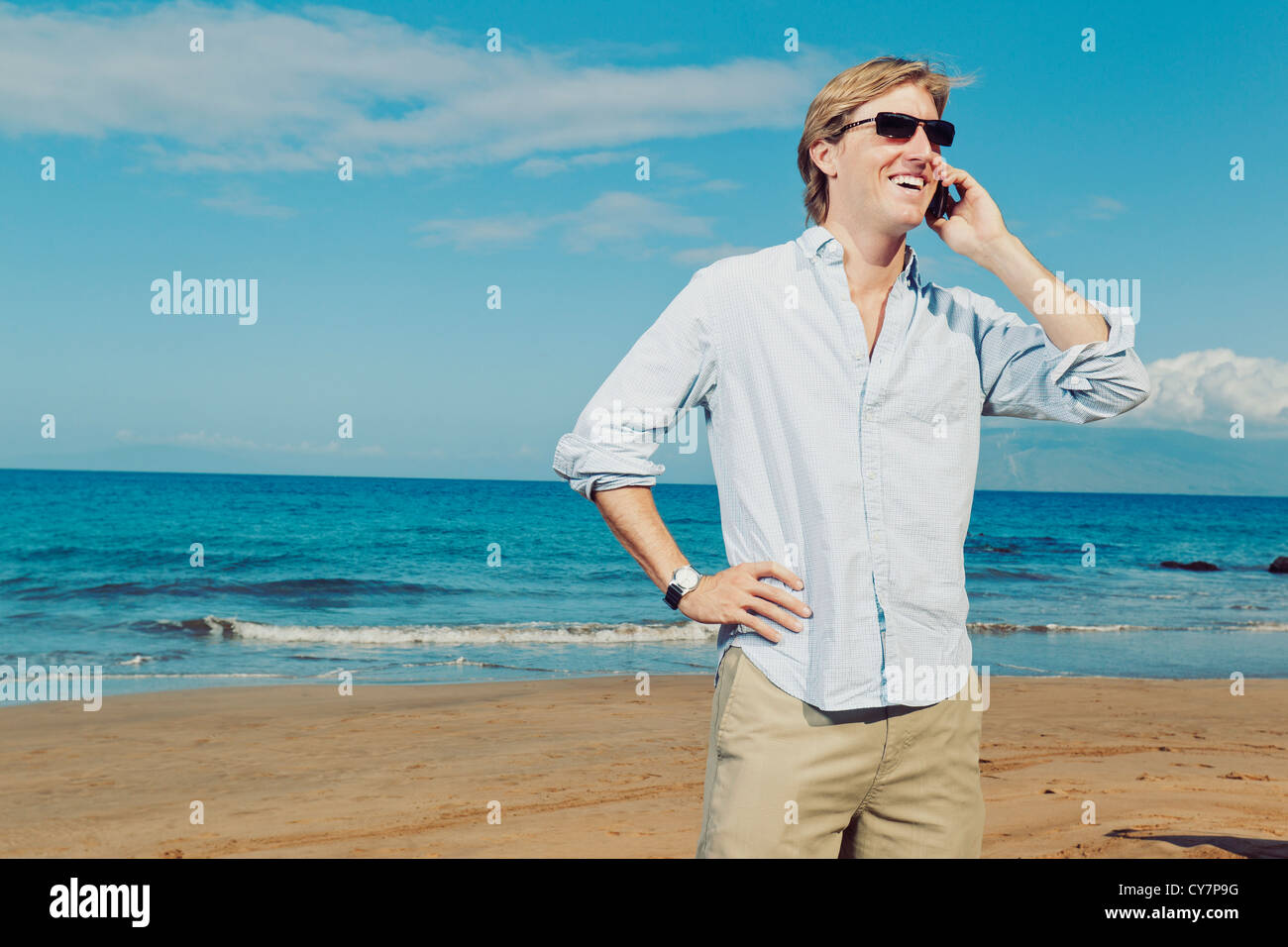Business man calling by cell phone on the beach Stock Photo - Alamy