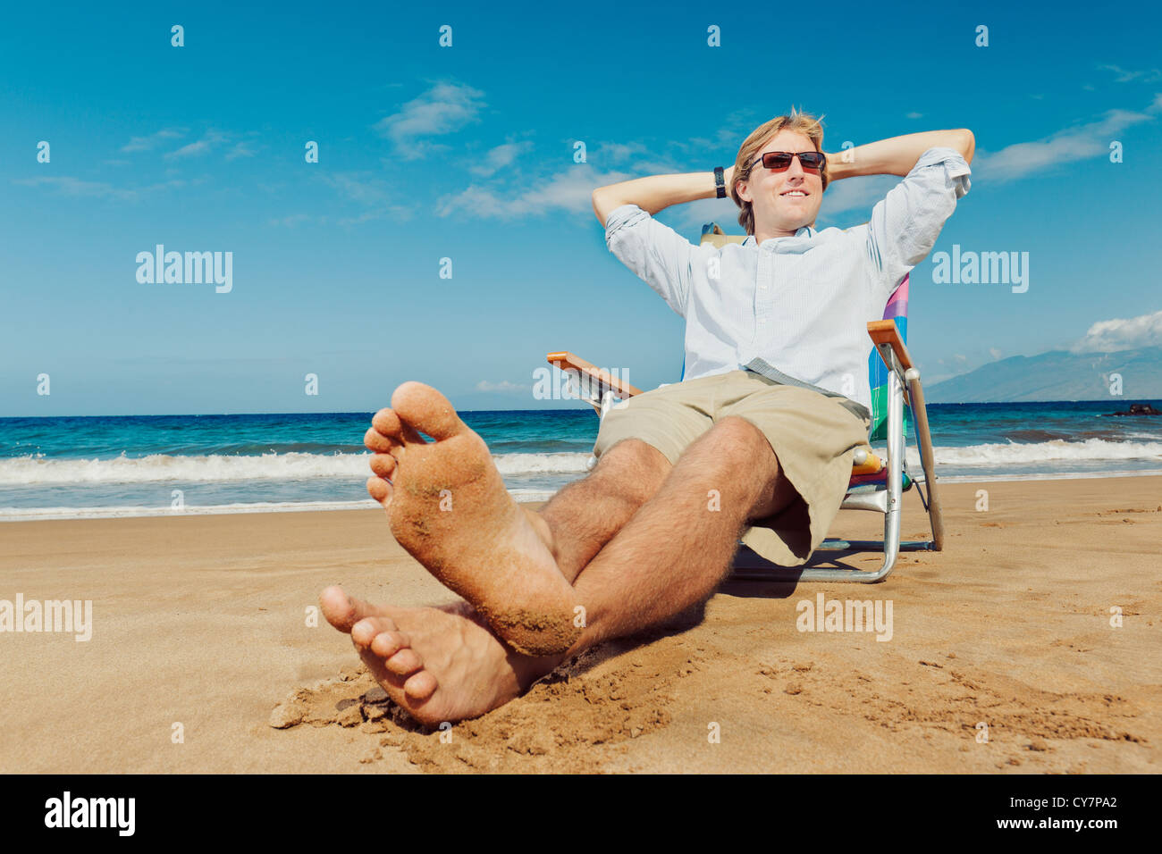 Young Attractive Man Relaxing at the Beach Stock Photo - Alamy