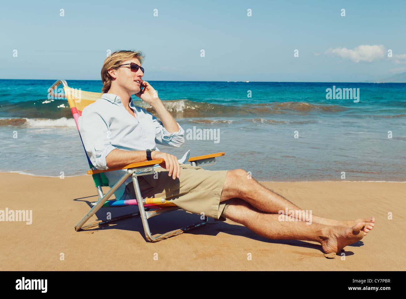 Business man calling by cell phone on the beach in Hawaii Stock Photo ...