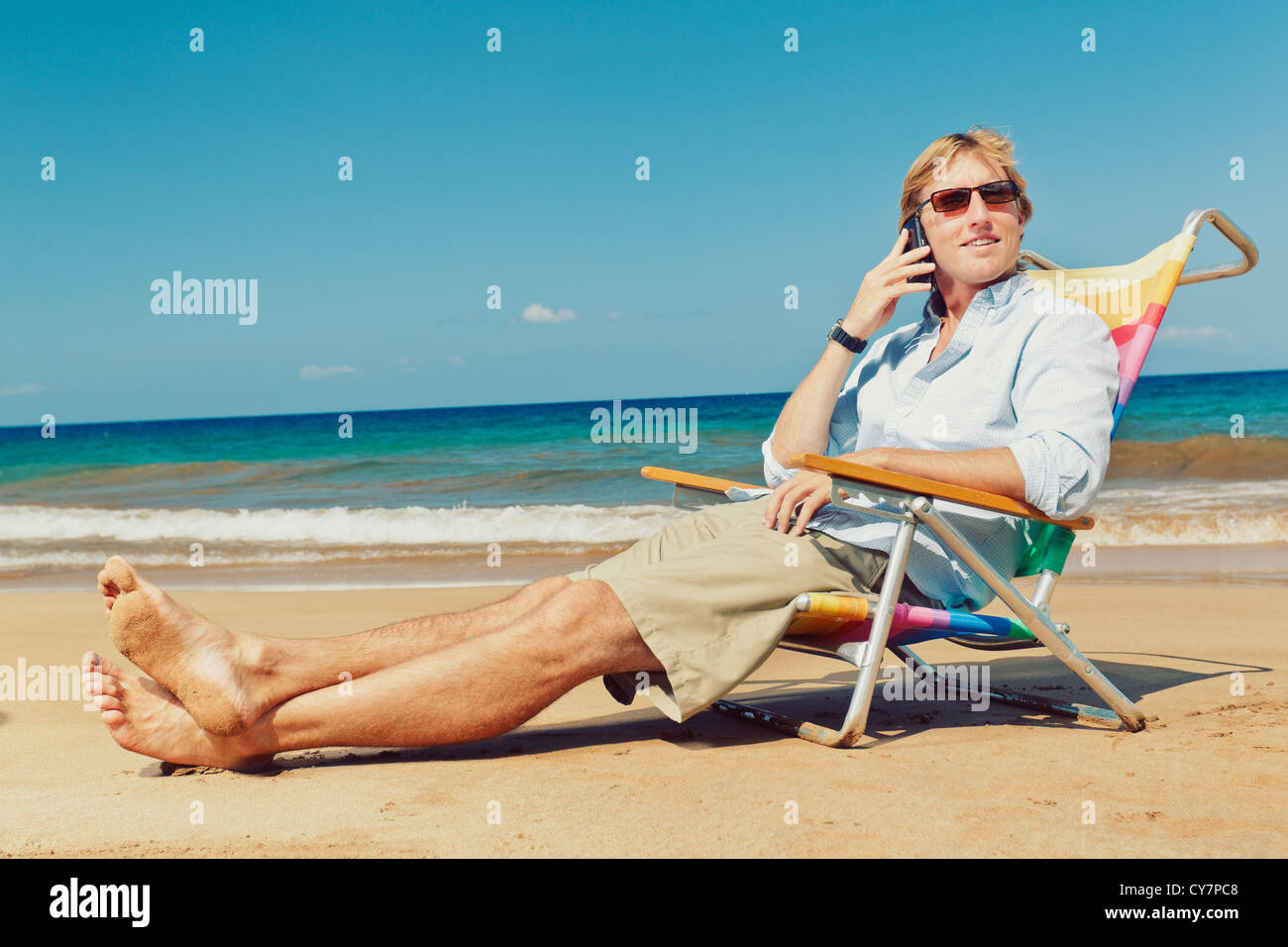 Business man calling by cell phone on the beach in Hawaii Stock Photo ...