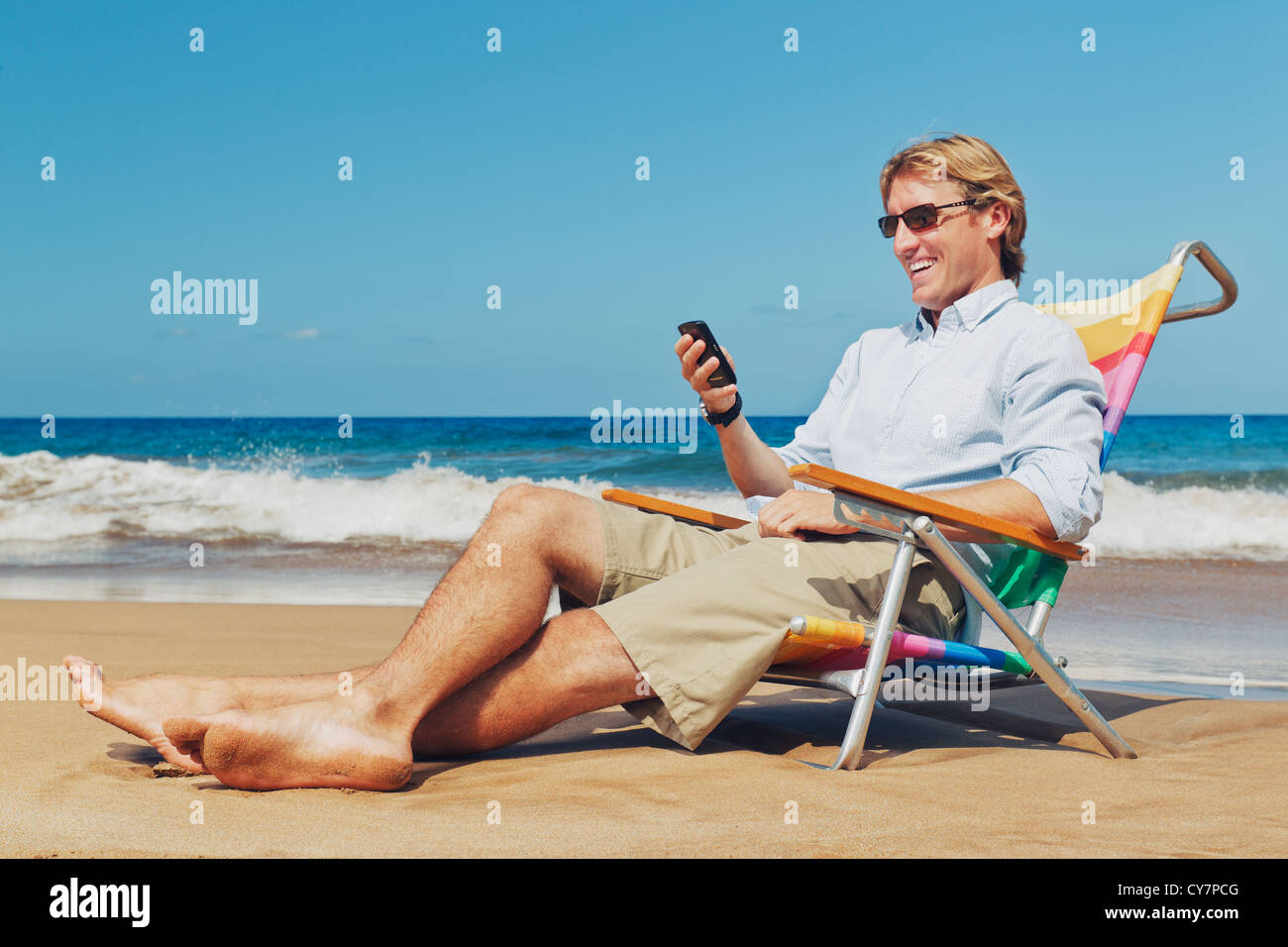 Business man calling by cell phone on the beach in Hawaii Stock Photo ...