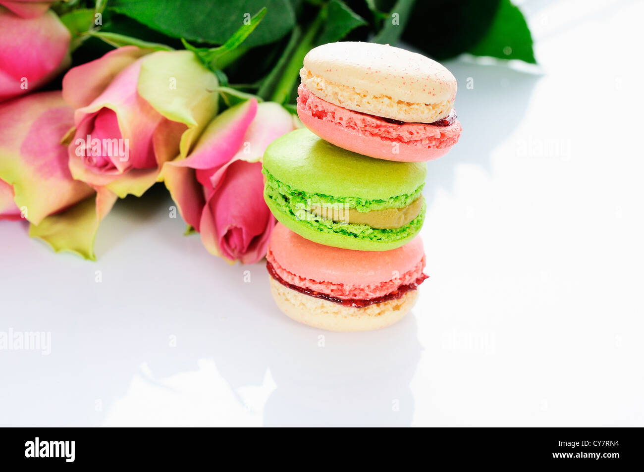 beautiful rose and assortment of macarons Stock Photo - Alamy
