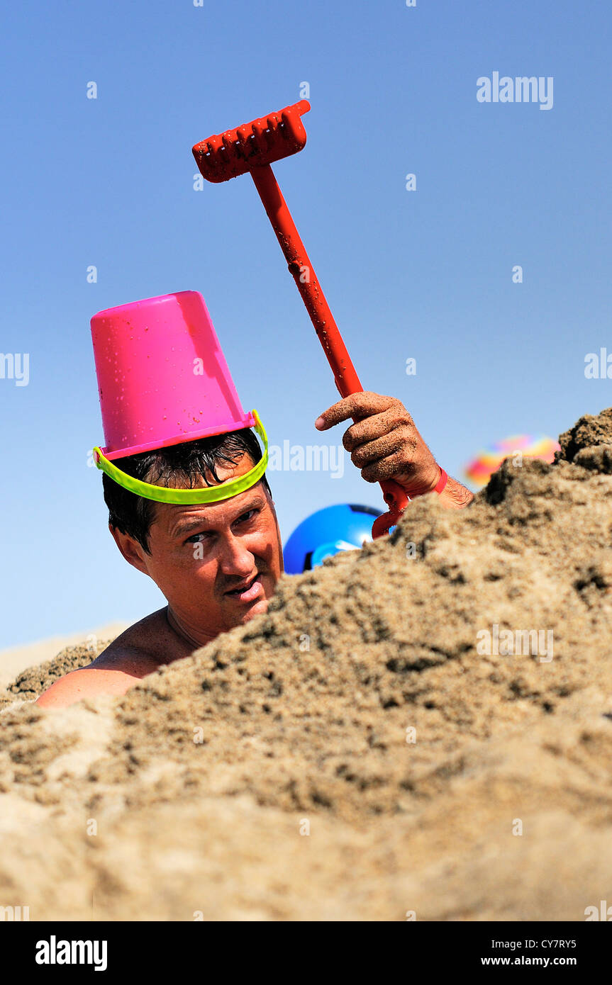 Man Bucket Sand High Resolution Stock Photography and Images - Alamy