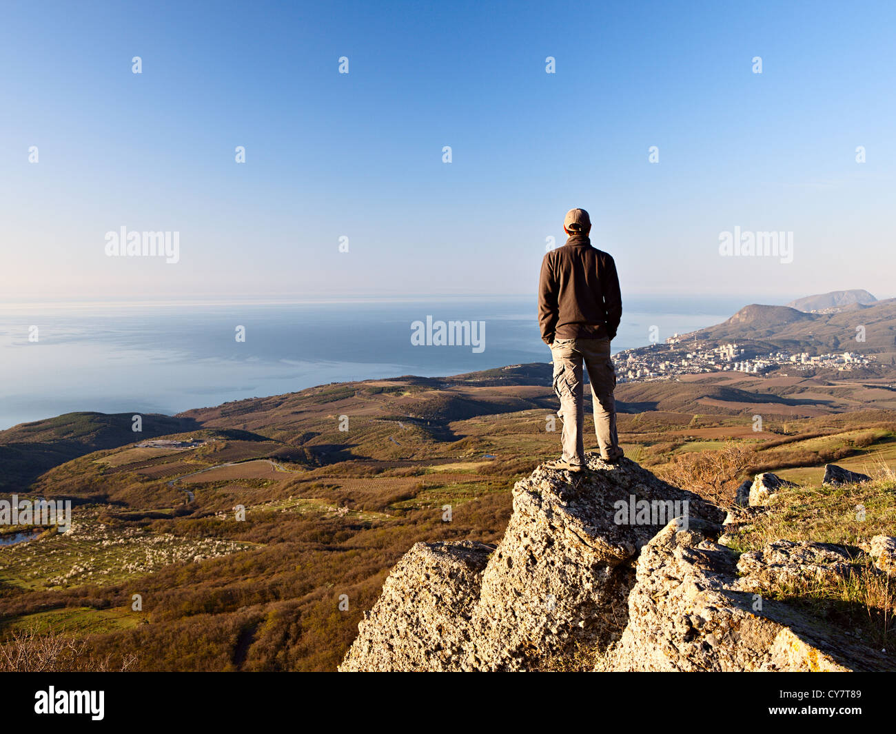 Man on the top of the mountain Stock Photo - Alamy