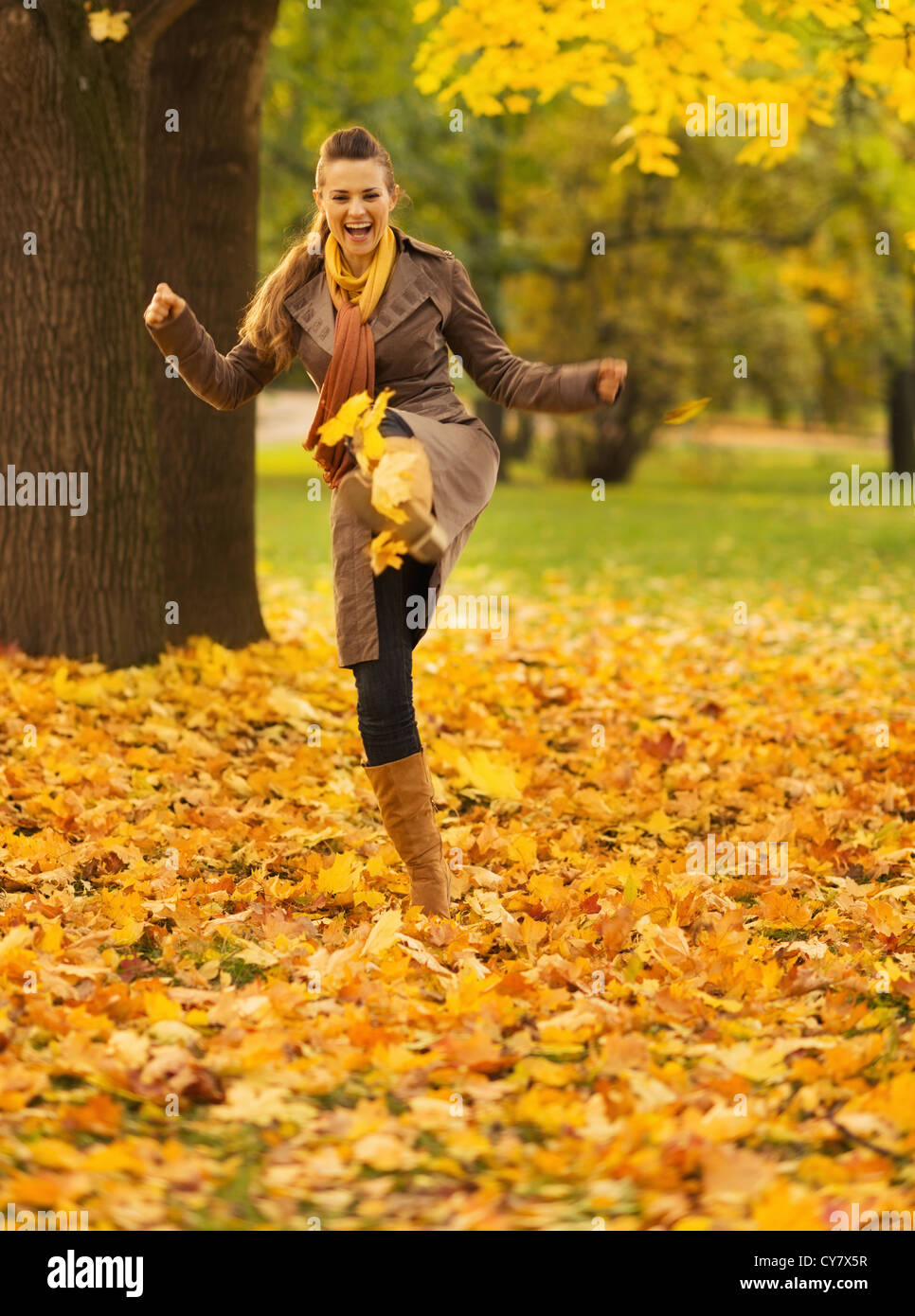 Woman kicking leaf hi-res stock photography and images - Alamy