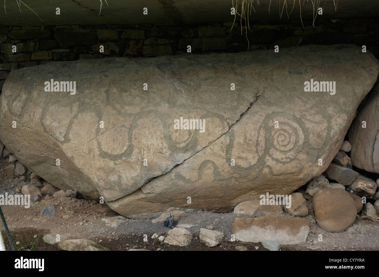 A kerbstone with stone age spirals and other markings at the neolithic ...