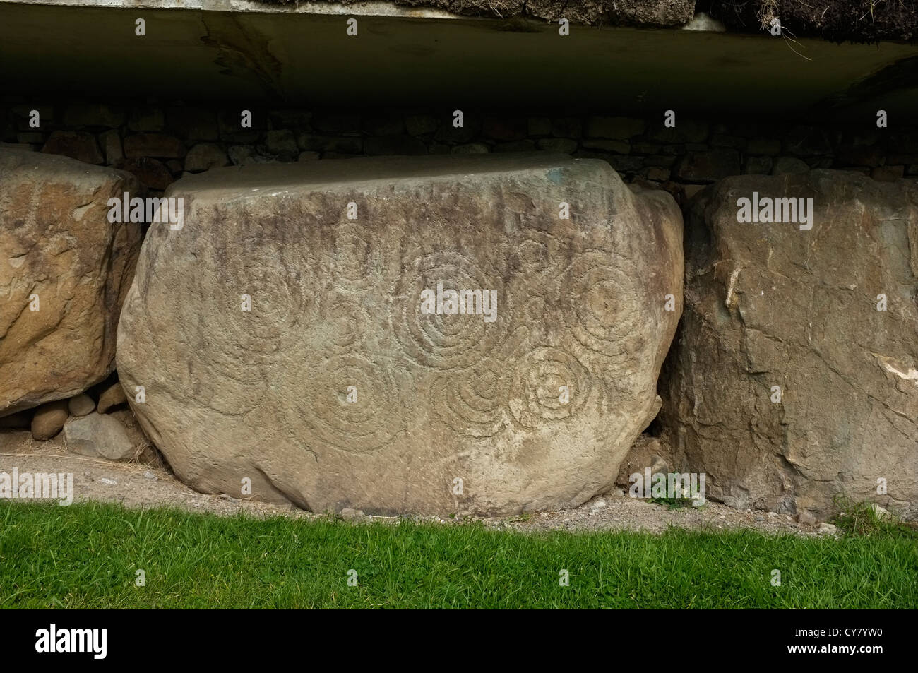 A kerbstone with stone age spirals and other markings at the neolithic ...