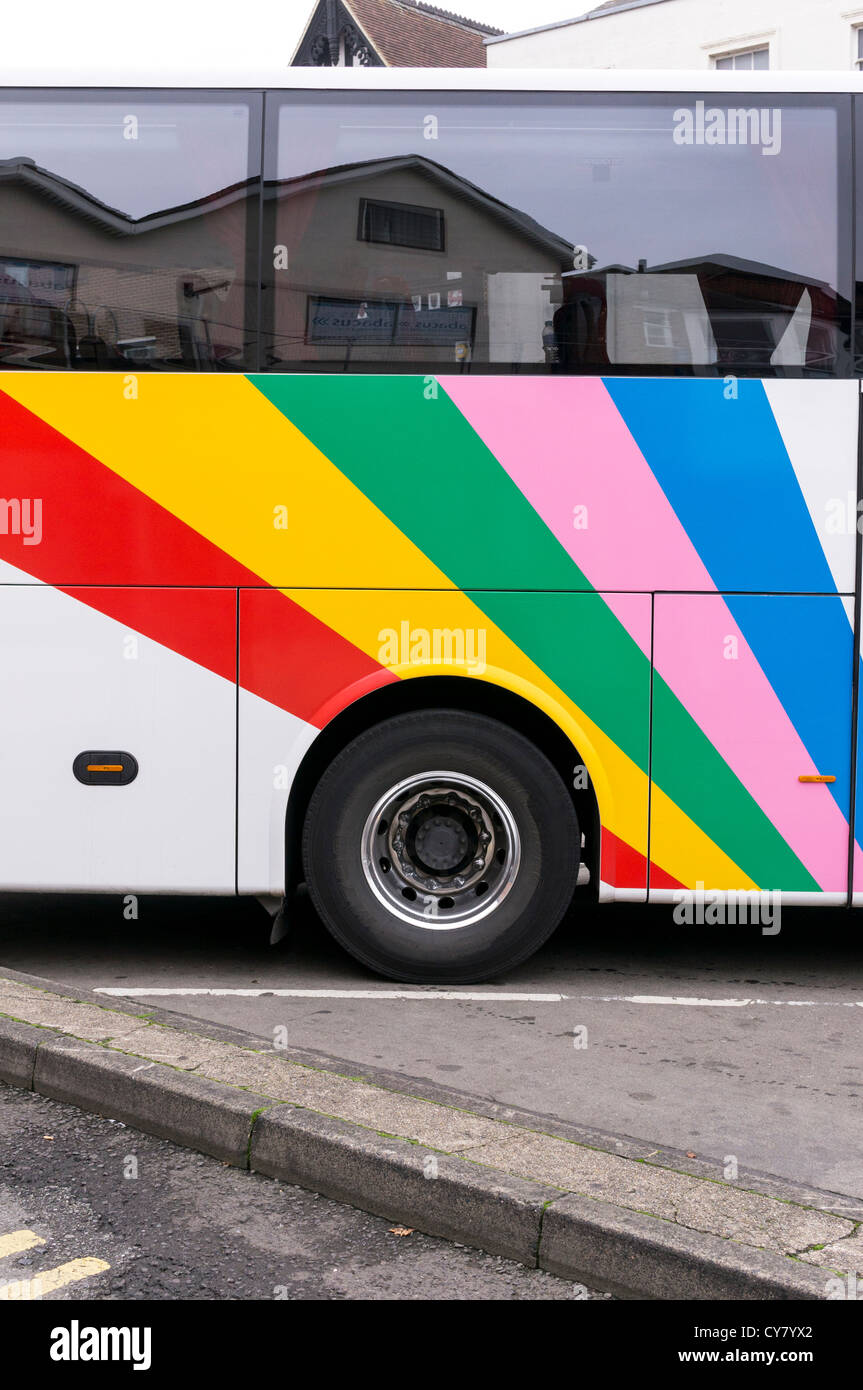Colourful stripes painted on the side of a tour coach bus Stock Photo ...