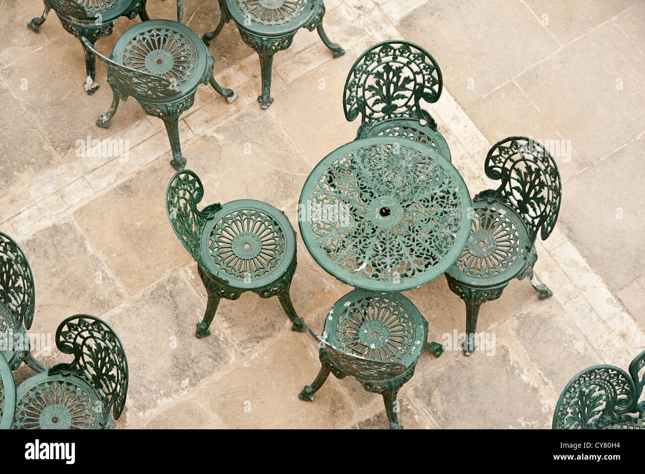 Table and chairs on patio Stock Photo - Alamy