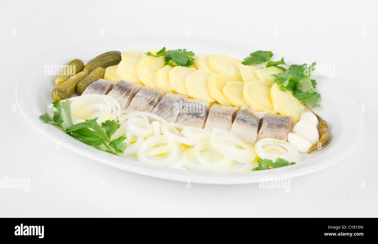Portion of herring fish fillets with potato and onion Stock Photo - Alamy