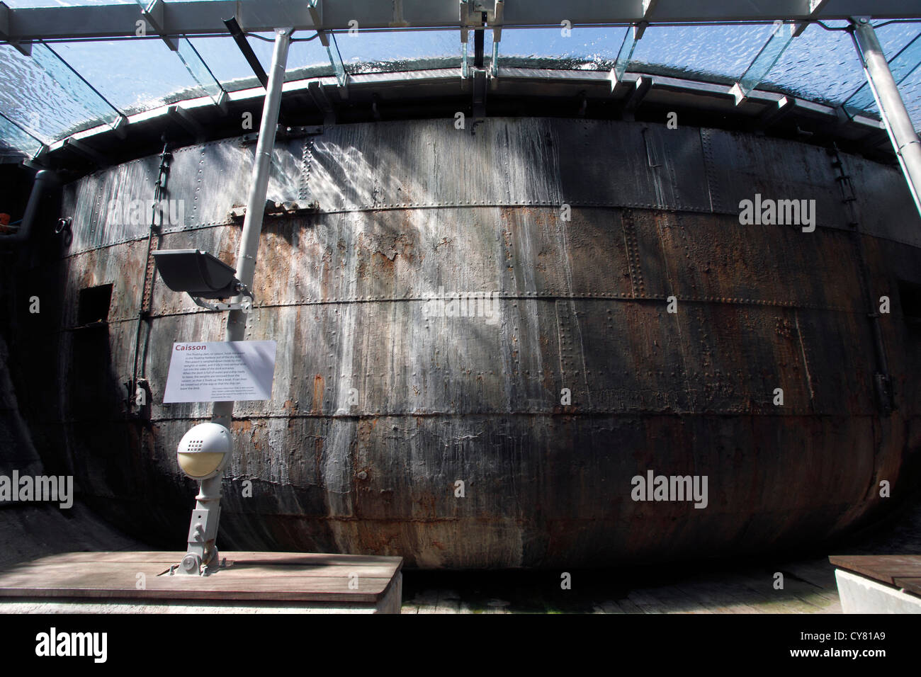 A floating dam or caisson that holds back water in a floating harbour ...