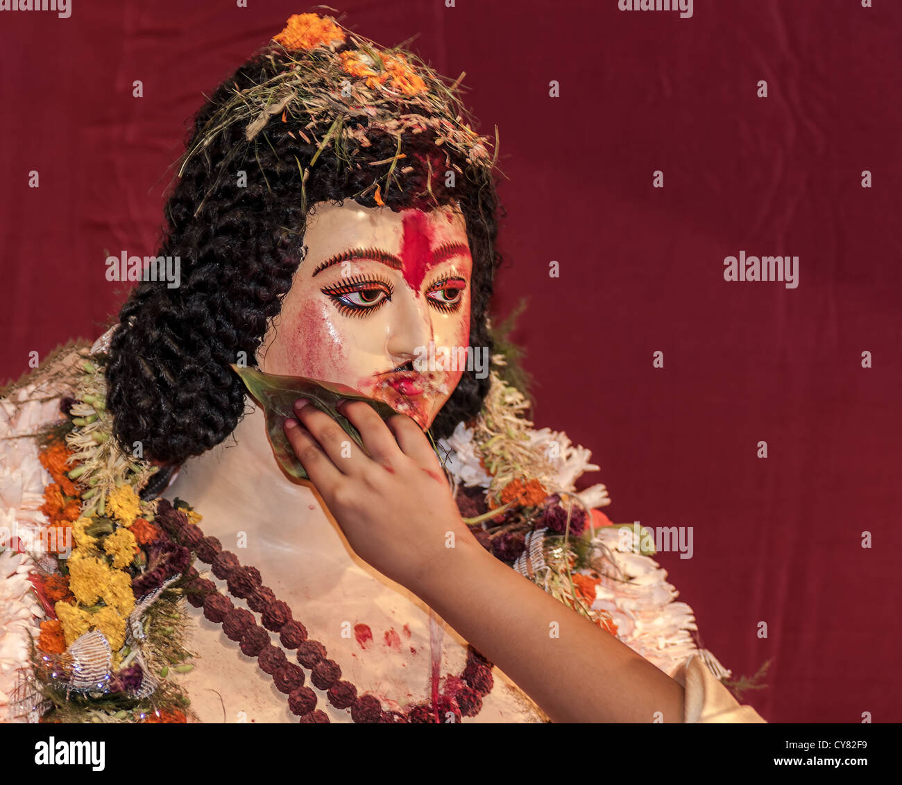 Bengali boy hindu devotee offering God Kartika on the traditional ...