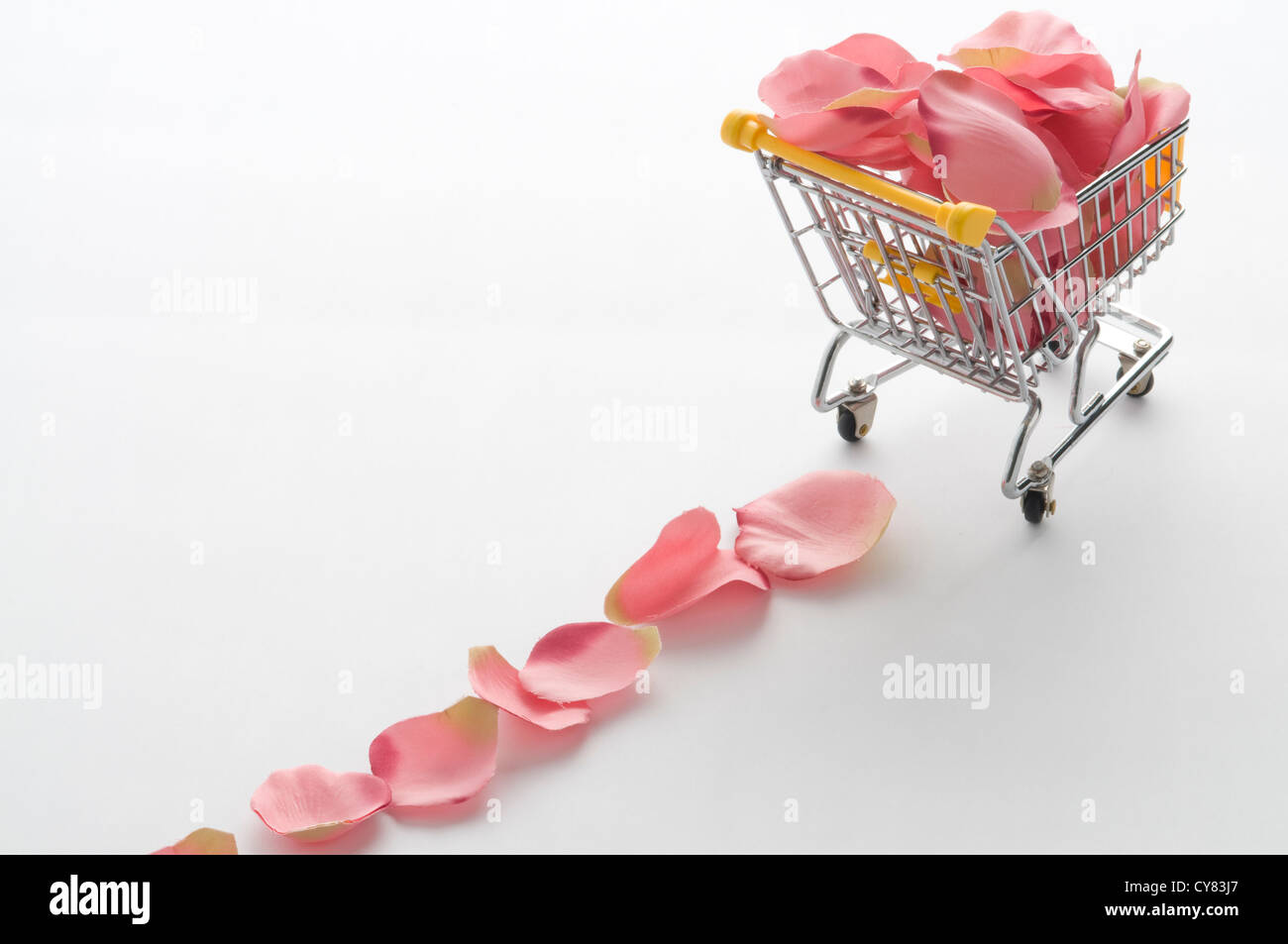 Supermarket cart with pink roses Stock Photo - Alamy