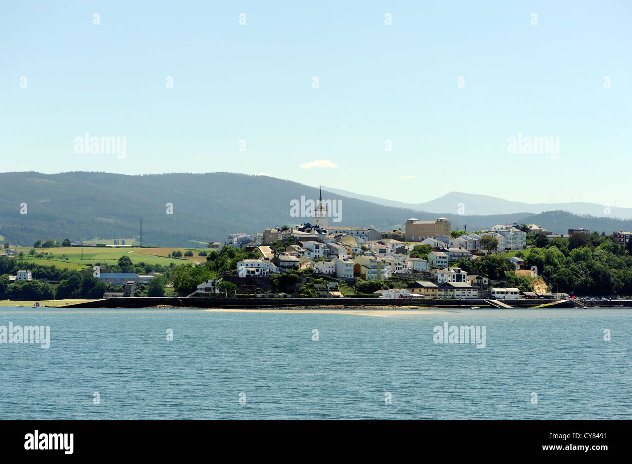 The town of Castropol iis dominated by the tower and spire of the ...