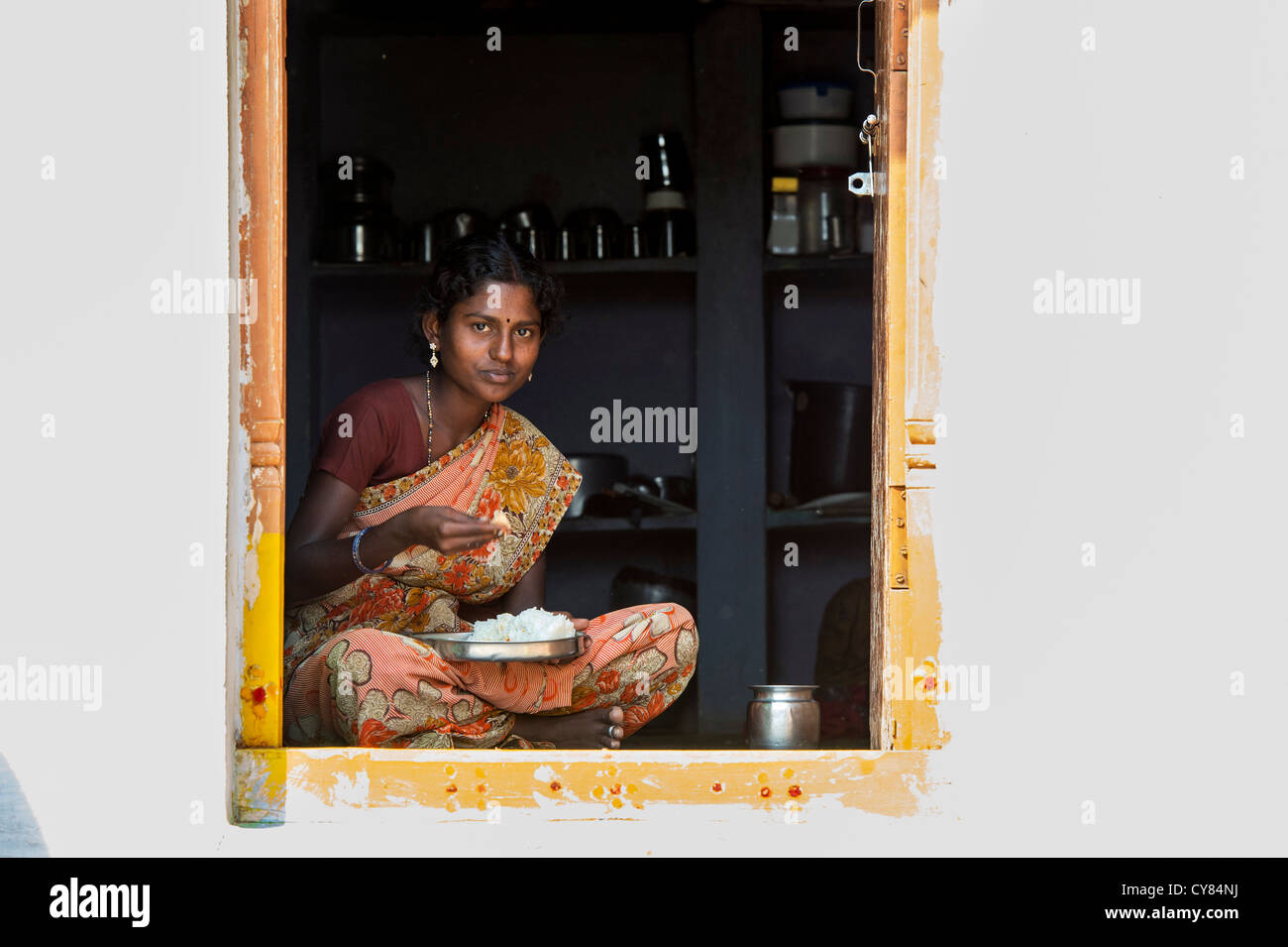 Indian family eating rice hi-res stock photography and images - Alamy