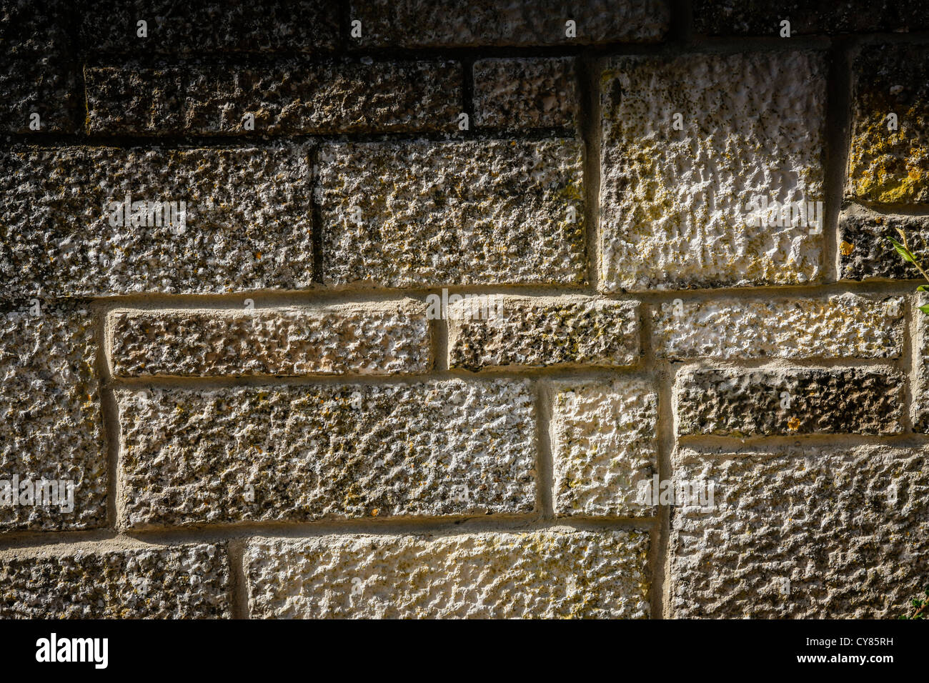 Random manufactured stone brick walling Stock Photo - Alamy