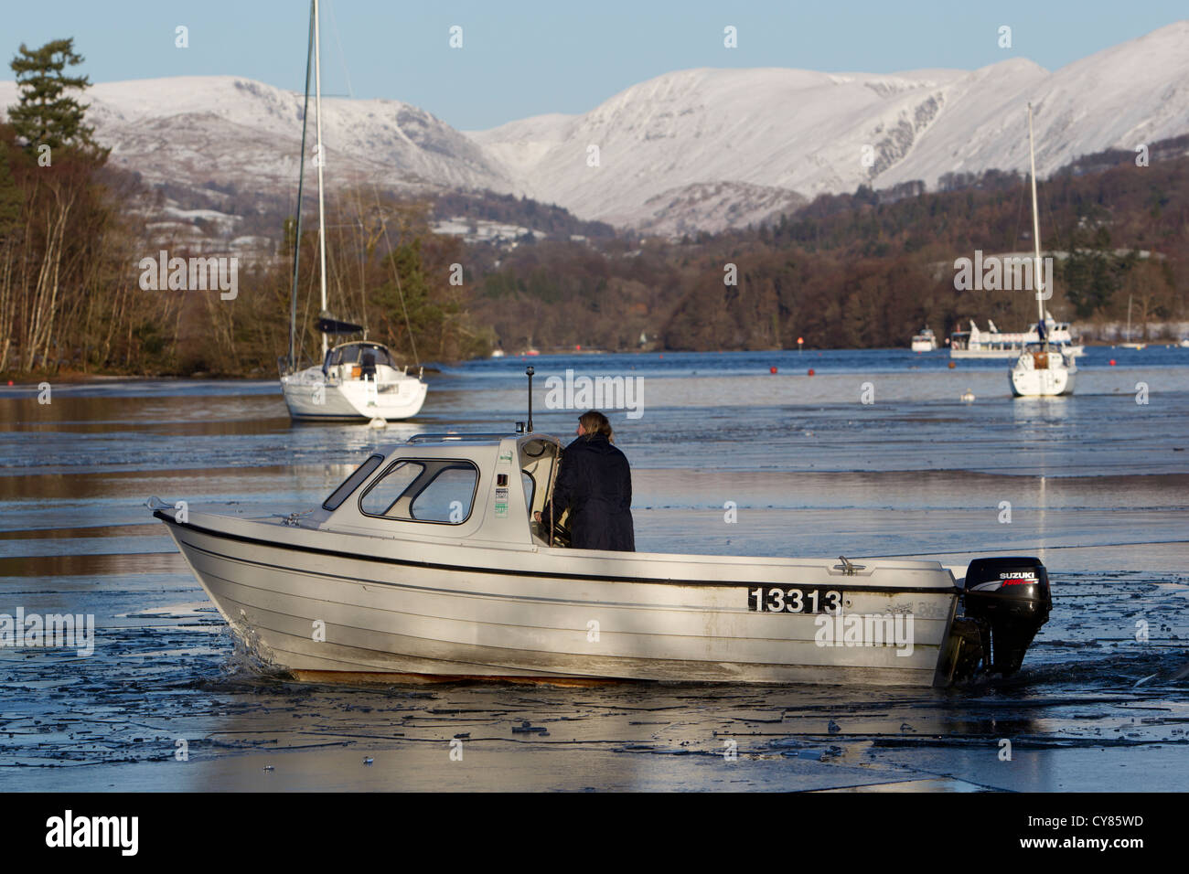 Lake Windermere winter snow & ice Belle Isle cut of by frozen lake iced ...