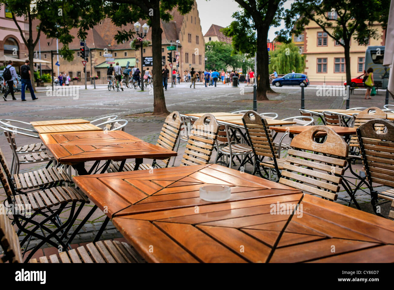 Tables and chairs outside a Brasserie in Corbeau Square, Strasbourg ...