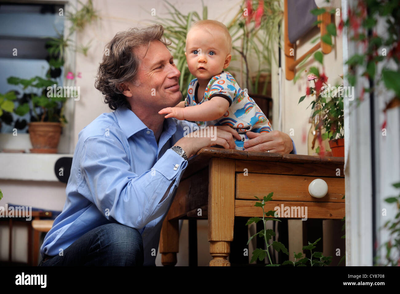 A middle aged father with his baby UK Stock Photo - Alamy