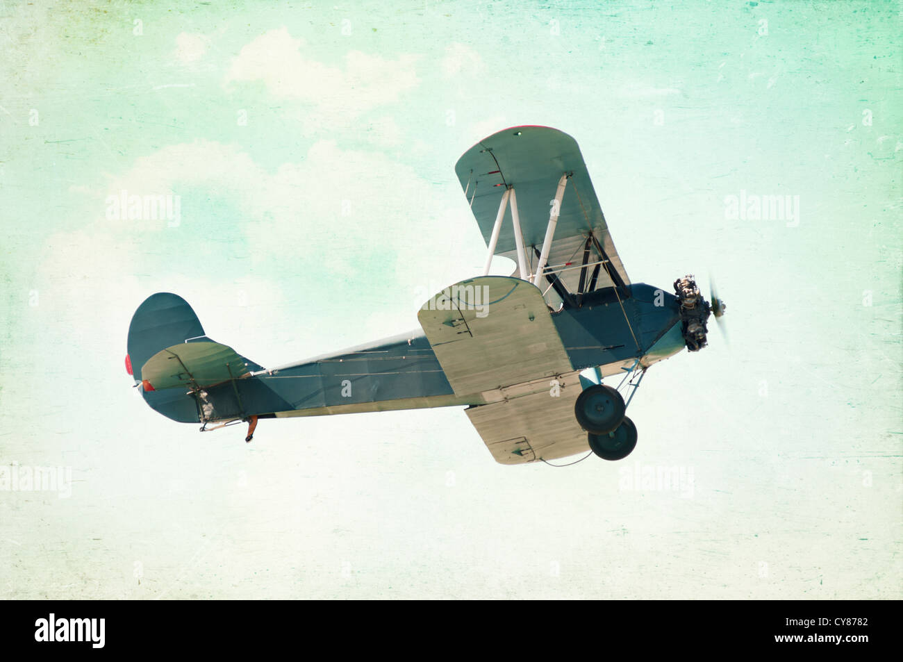 Retro airplane flying Stock Photo - Alamy