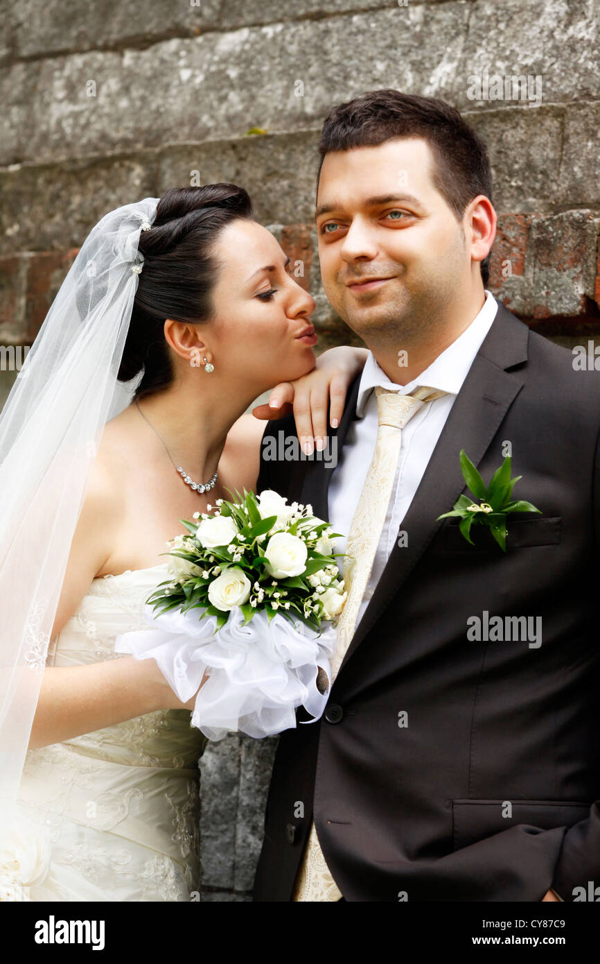 Newly-married couple in wedding clothes in park Stock Photo - Alamy