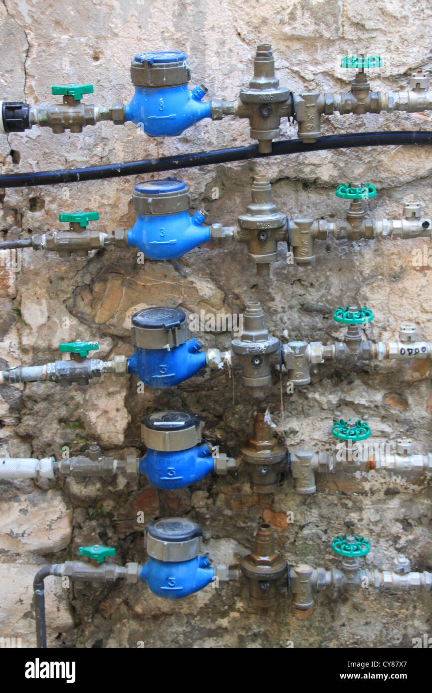 External pluming on stone wall Stock Photo - Alamy