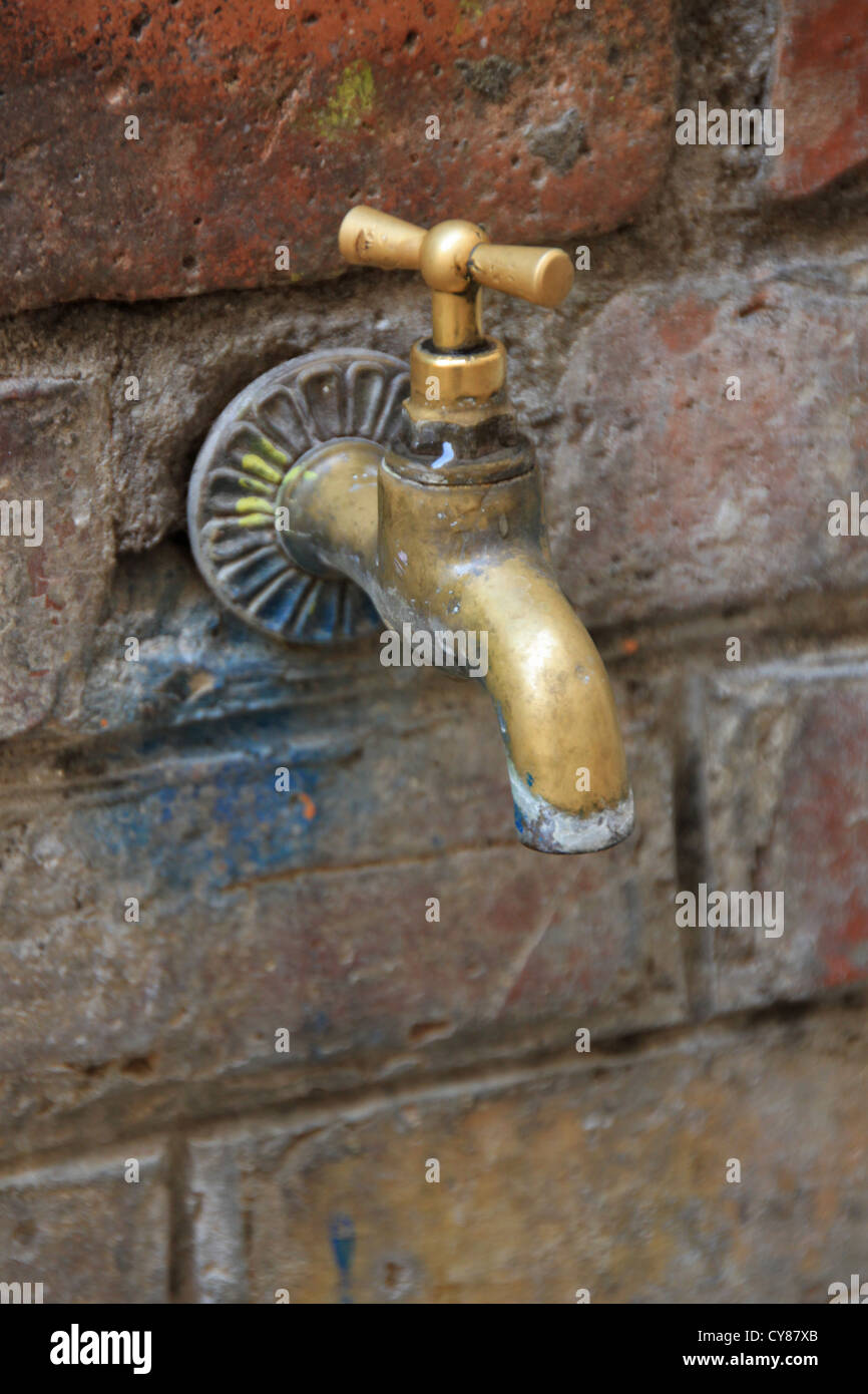 Old bronze water tap Stock Photo - Alamy