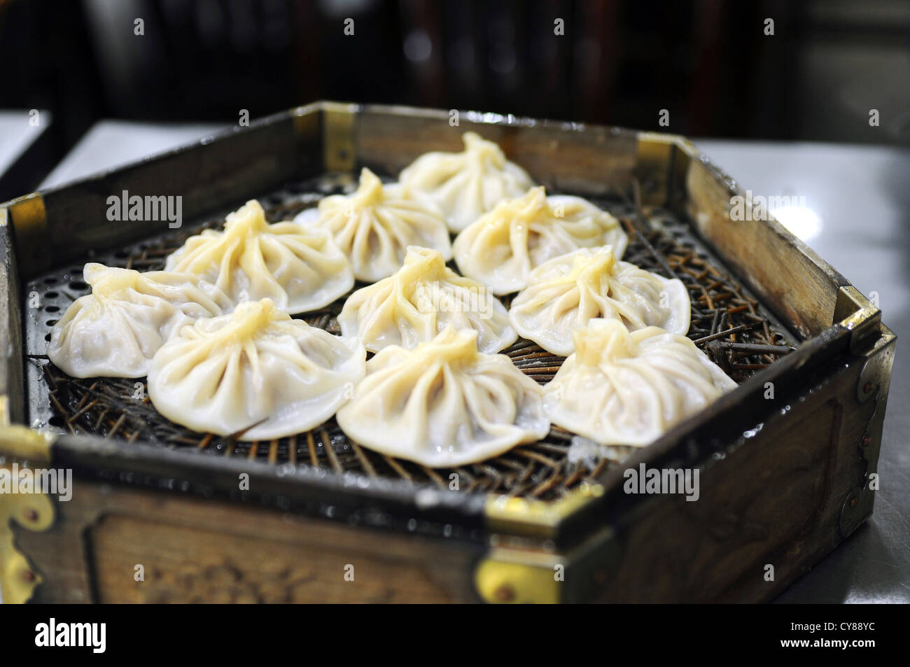 Chinese steamed dumplings in a steamer basket Stock Photo - Alamy