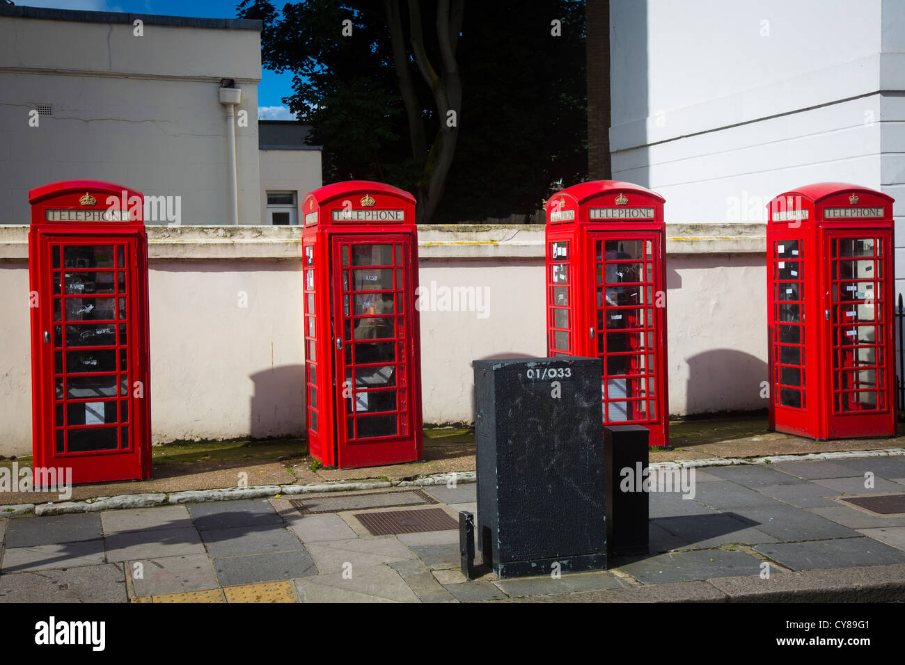 Typical red phone booths in the city of London Stock Photo - Alamy
