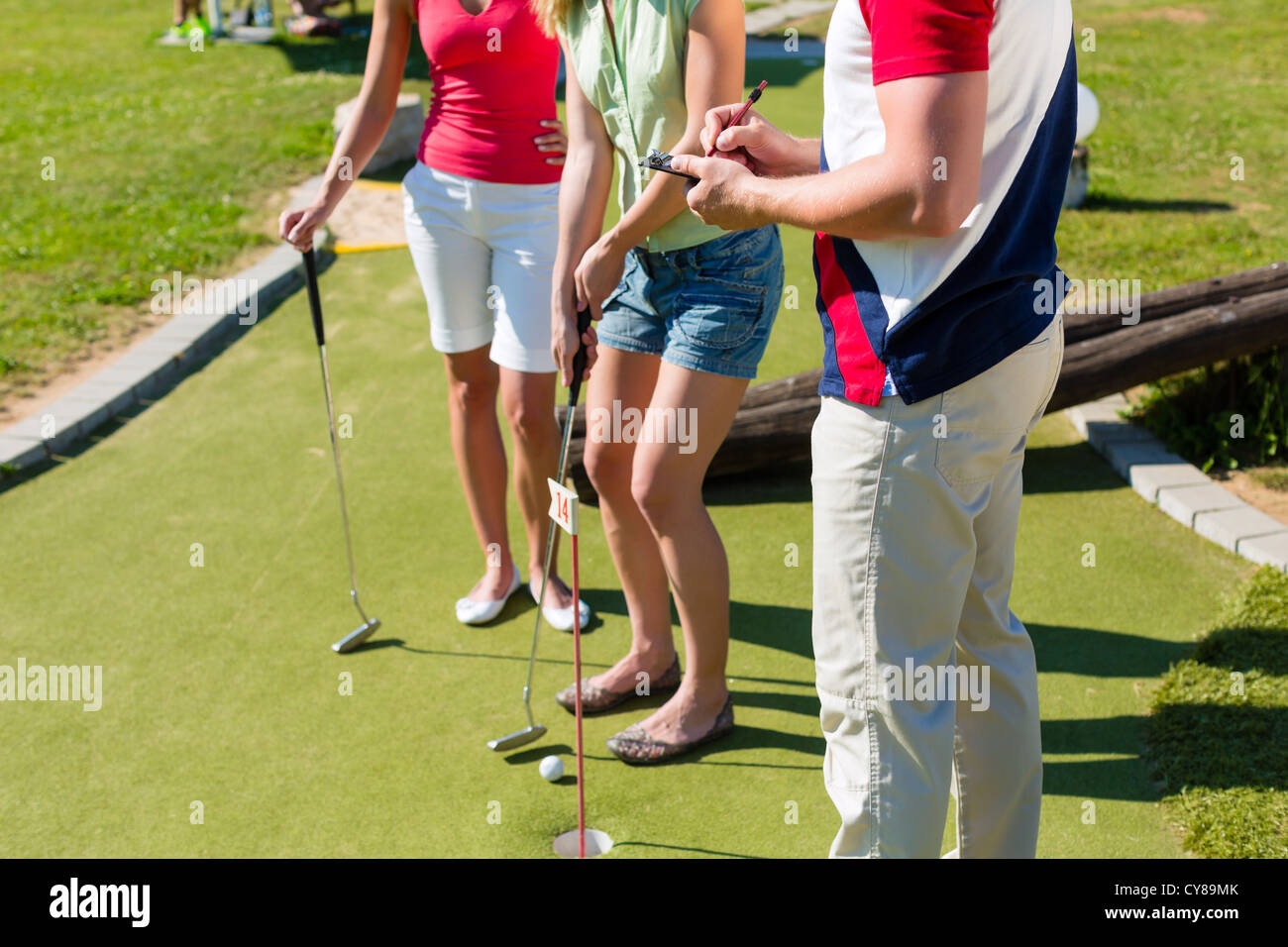 Young man woman miniature golf hi-res stock photography and images - Alamy
