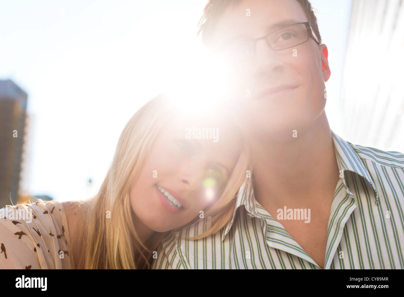 Couple looking dreamily into the sky and is happy to be together Stock ...