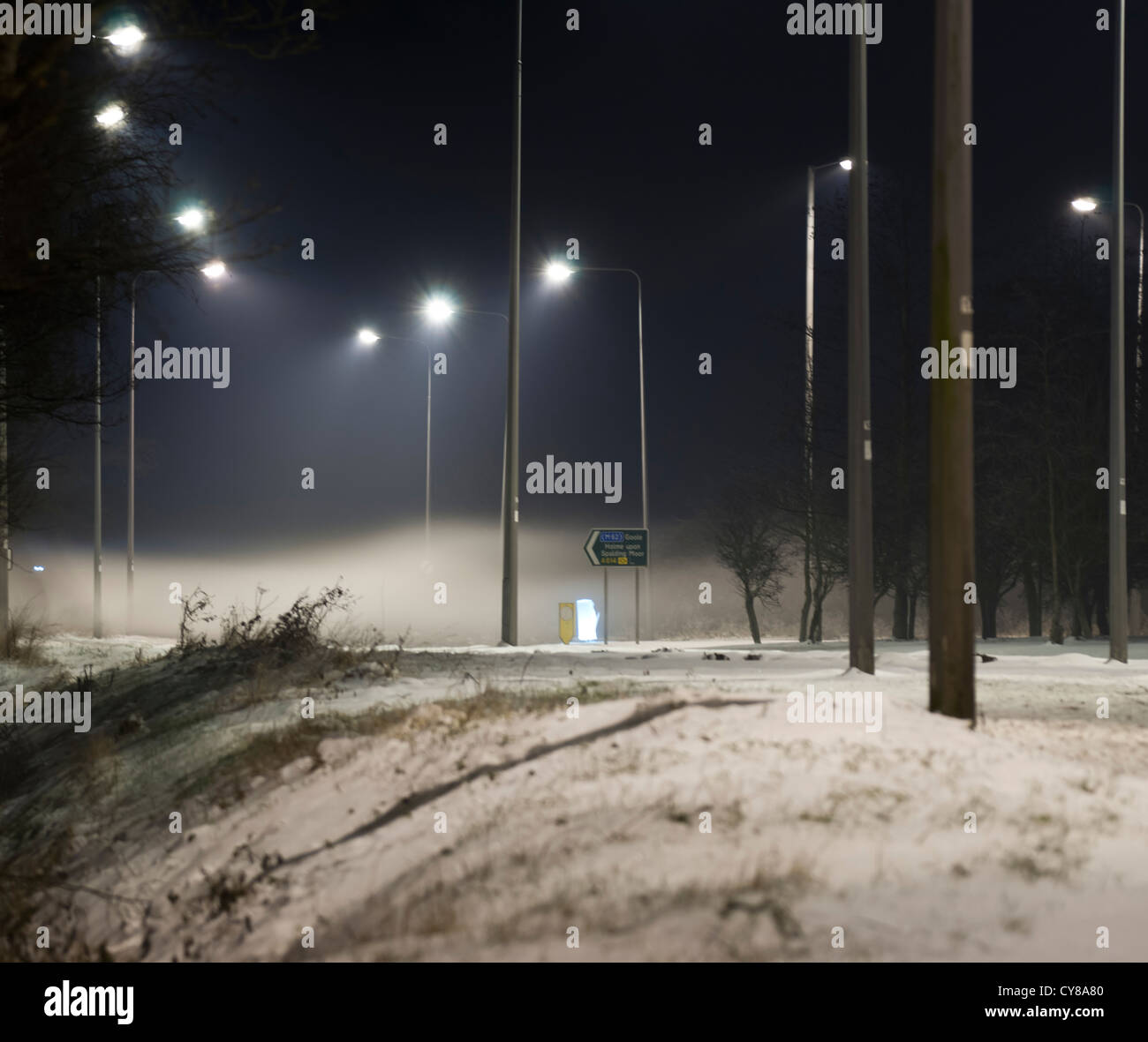 Road with snow and street lights hi-res stock photography and images ...