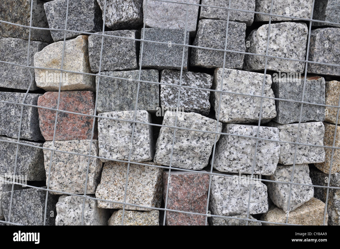 Stone paving stones of granite in a steel container Stock Photo - Alamy