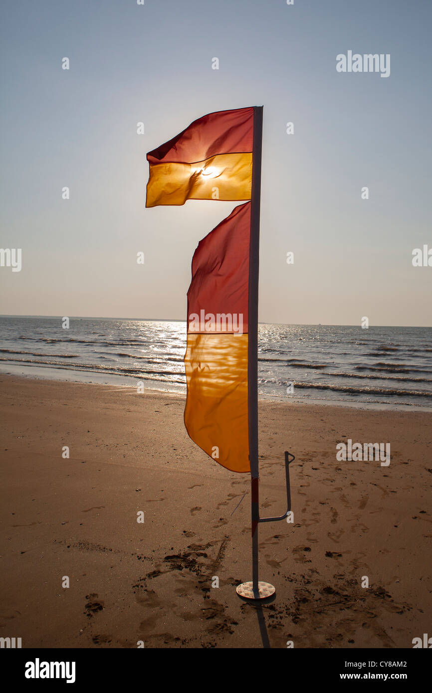 Red and yellow safety flag on Mindil beach, Darwin Stock Photo - Alamy