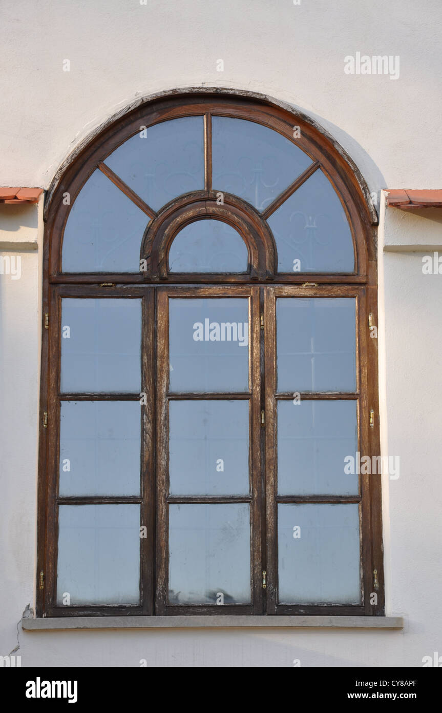 Arched window on the wall of the castle Stock Photo - Alamy