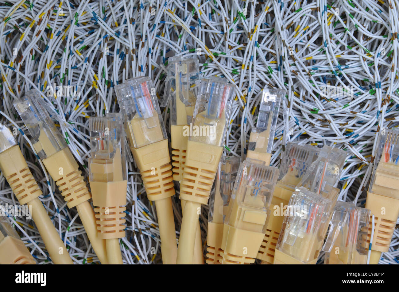 Yellow plugs, access to the global Internet Stock Photo - Alamy