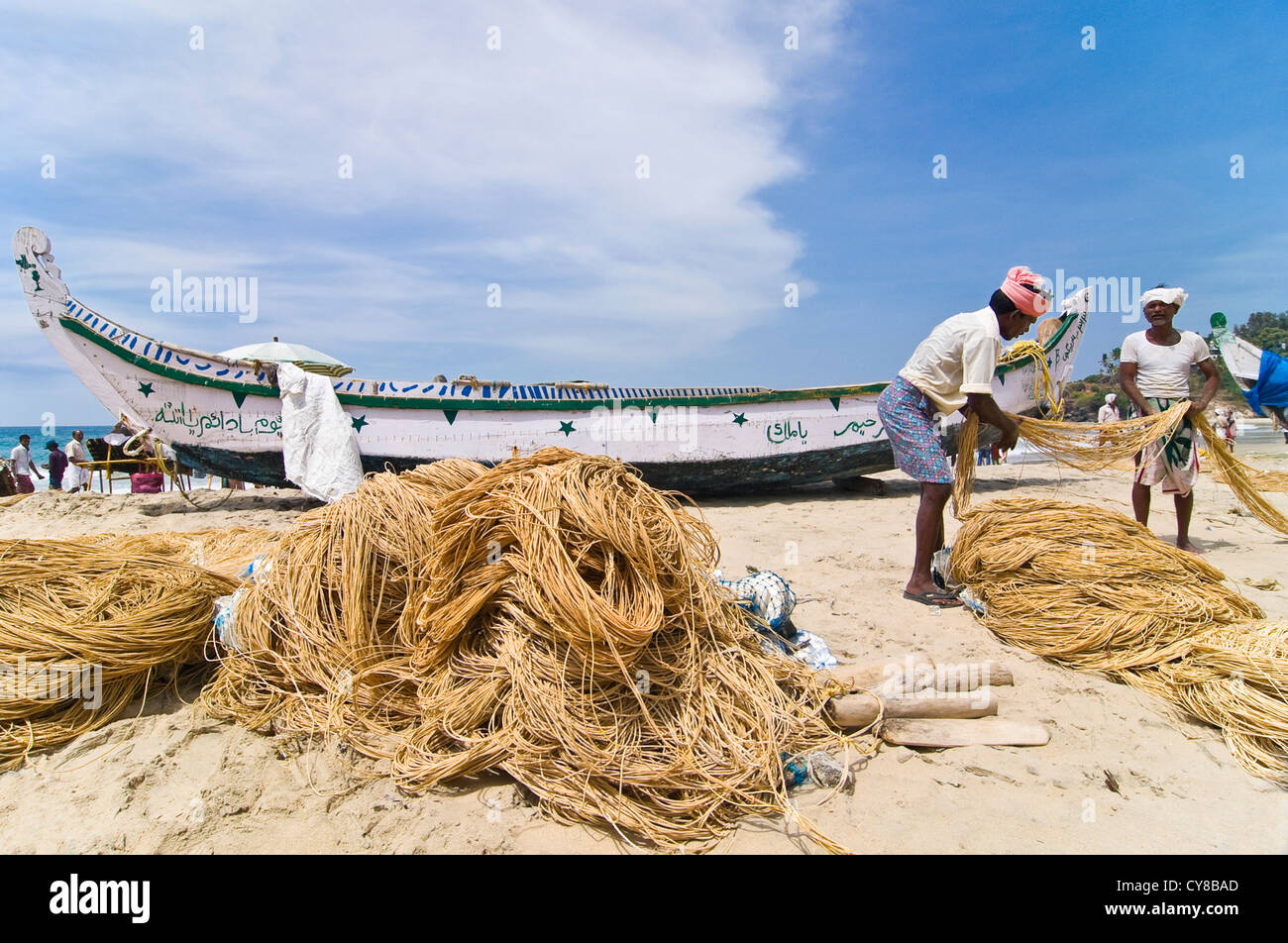 Fishermen checking their fishing nets hi-res stock photography and ...