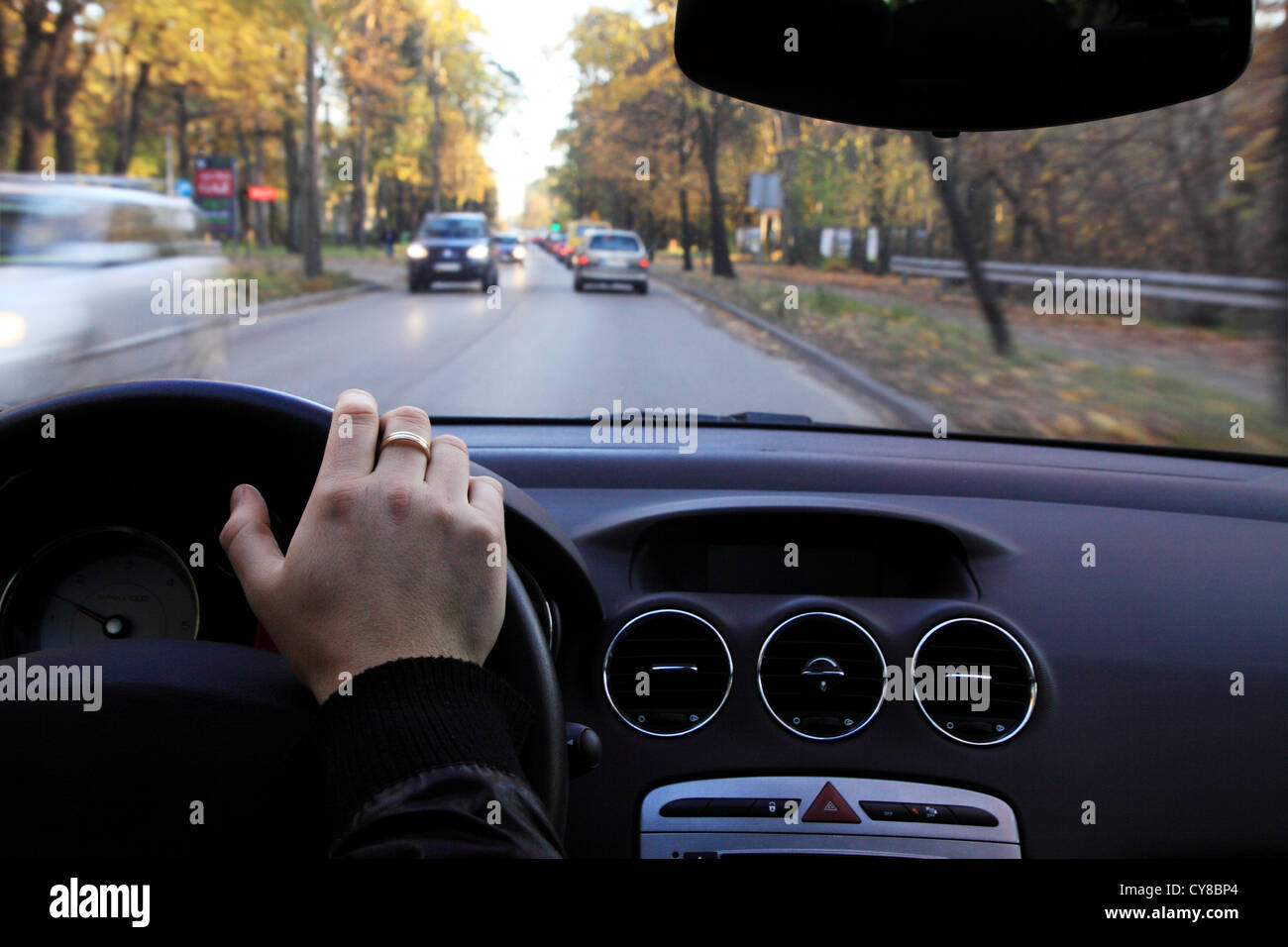 Driving a car on small road Stock Photo - Alamy