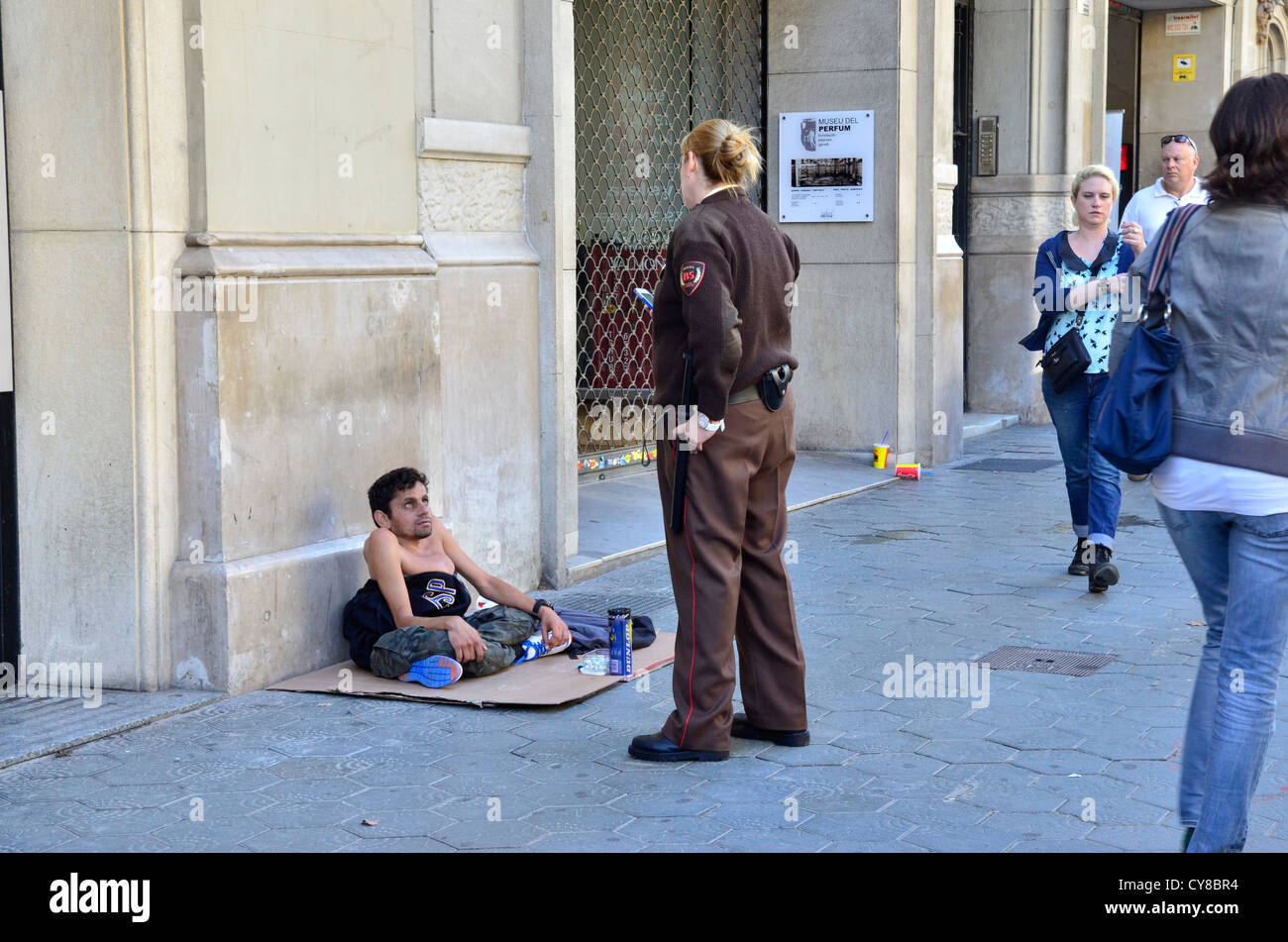 Homeless being photographied and harassed by security guard Stock Photo ...