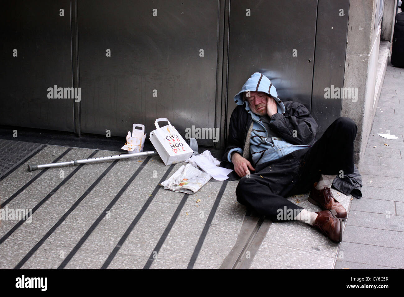 Homeless man near the entrance of London Bridge underground station ...