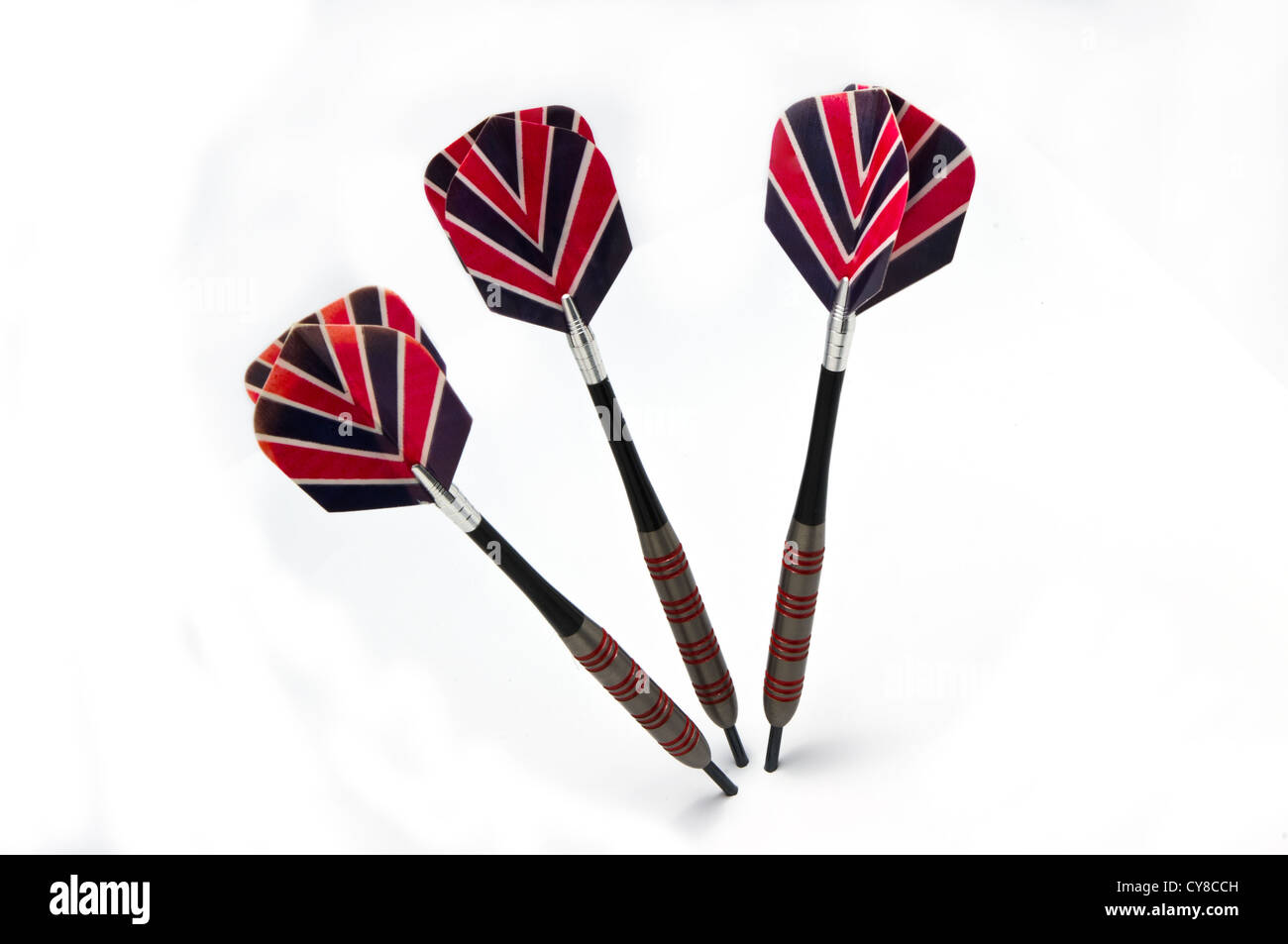 Three darts thrown into a white background Stock Photo - Alamy