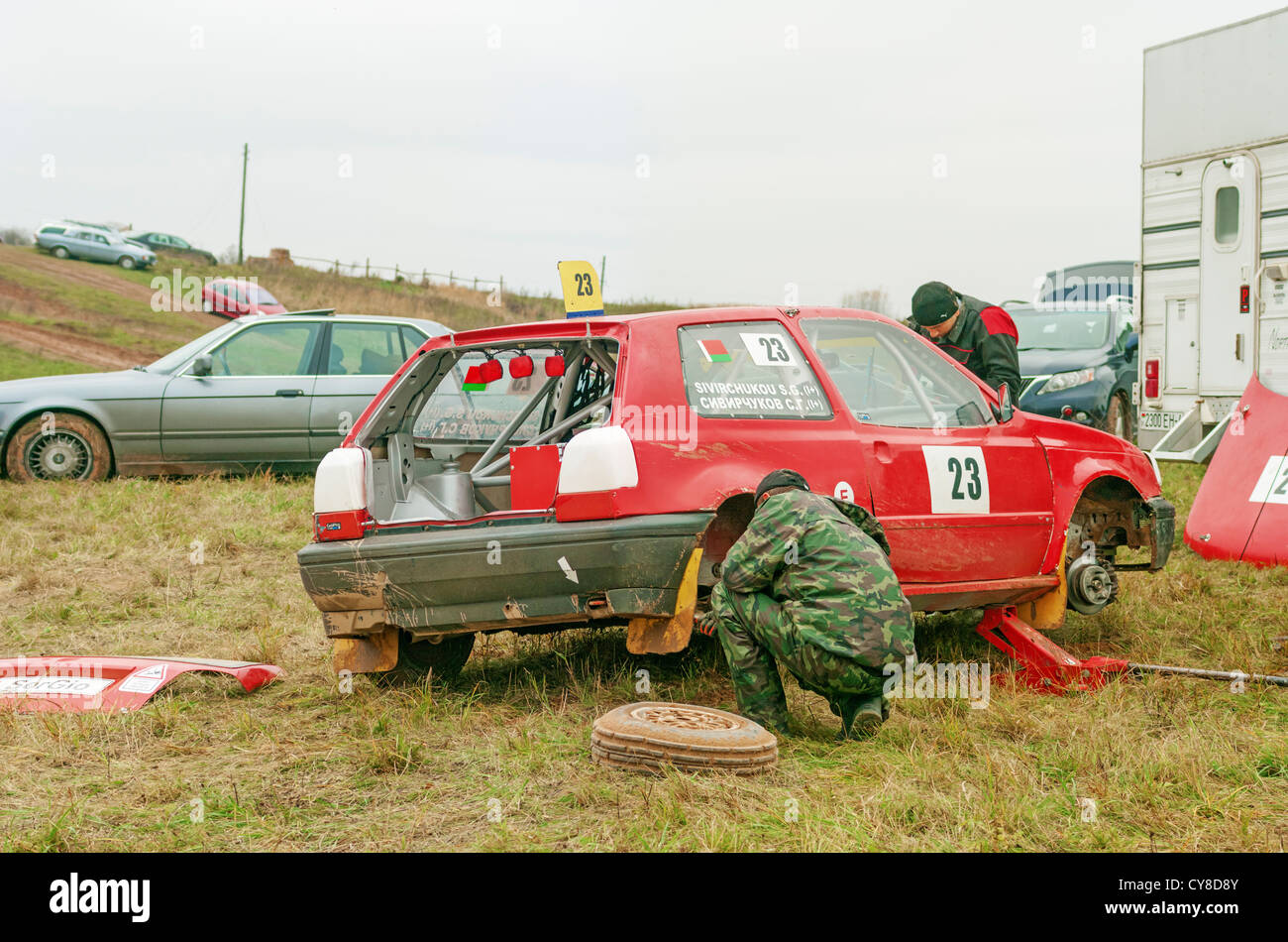 Mechanics repair the red racing car Stock Photo - Alamy