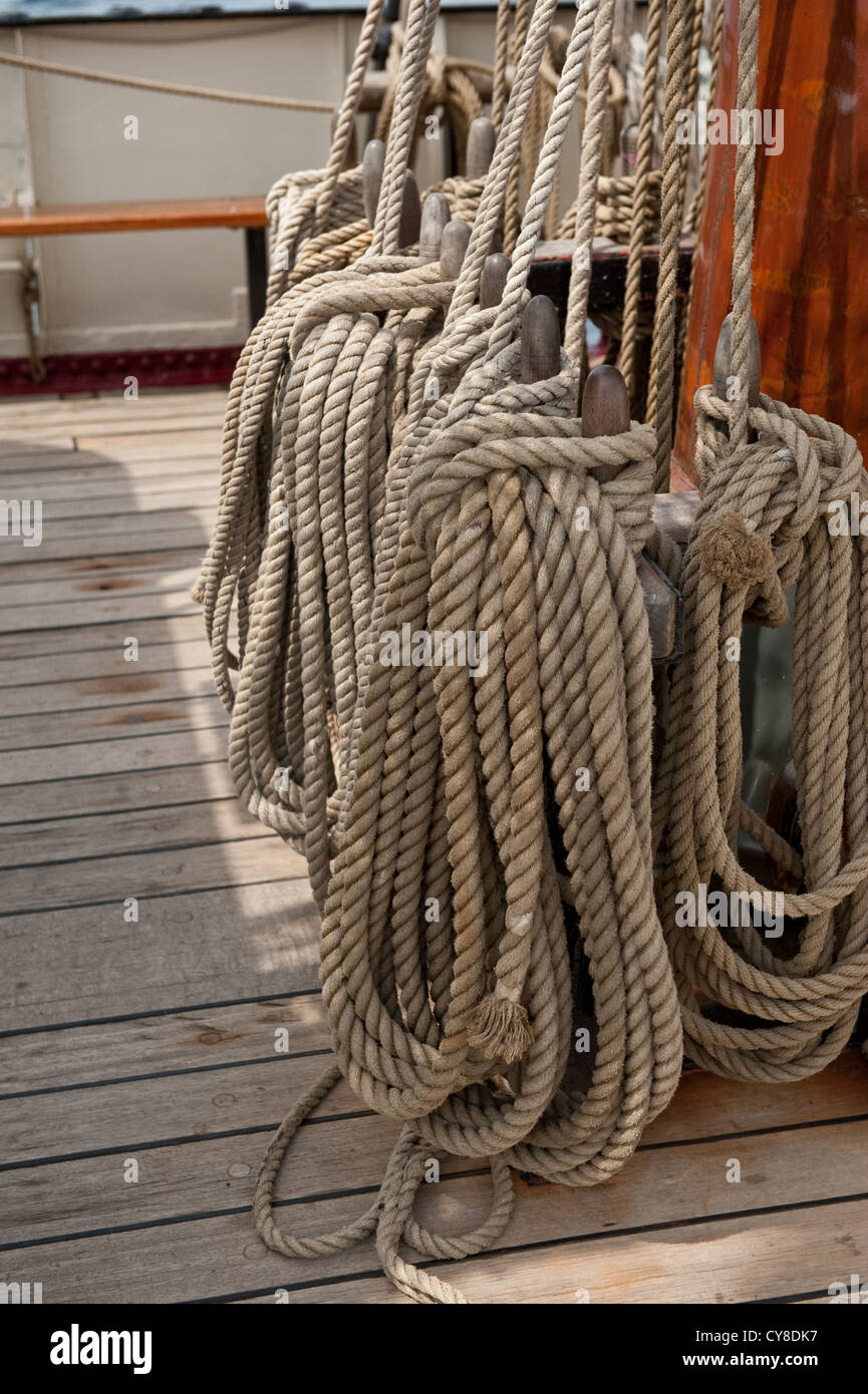 Sail halyards tied neatly on historic tall ship Stock Photo - Alamy