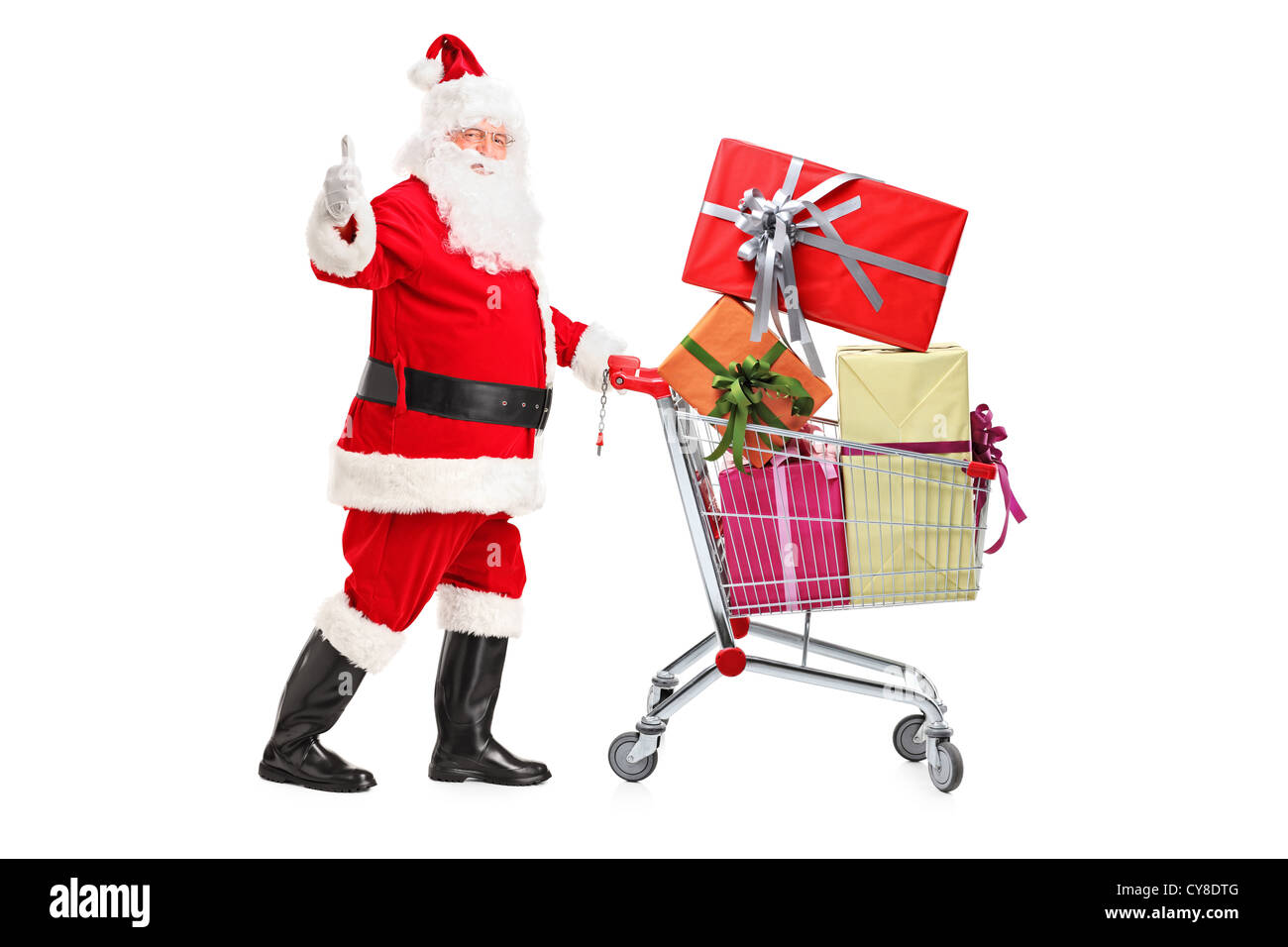 Santa Claus pushing a shopping cart full of gifts and giving a thumb up ...