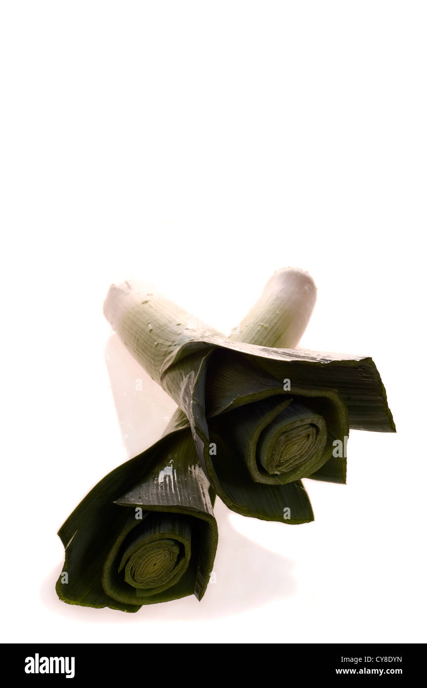 Raw leeks photographed on a white background Stock Photo - Alamy