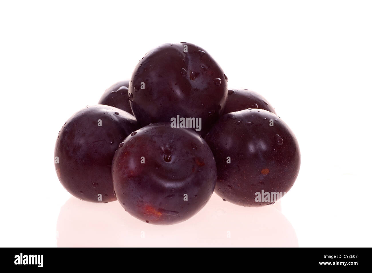 stack of whole plum fruits photographed on a white background Stock ...