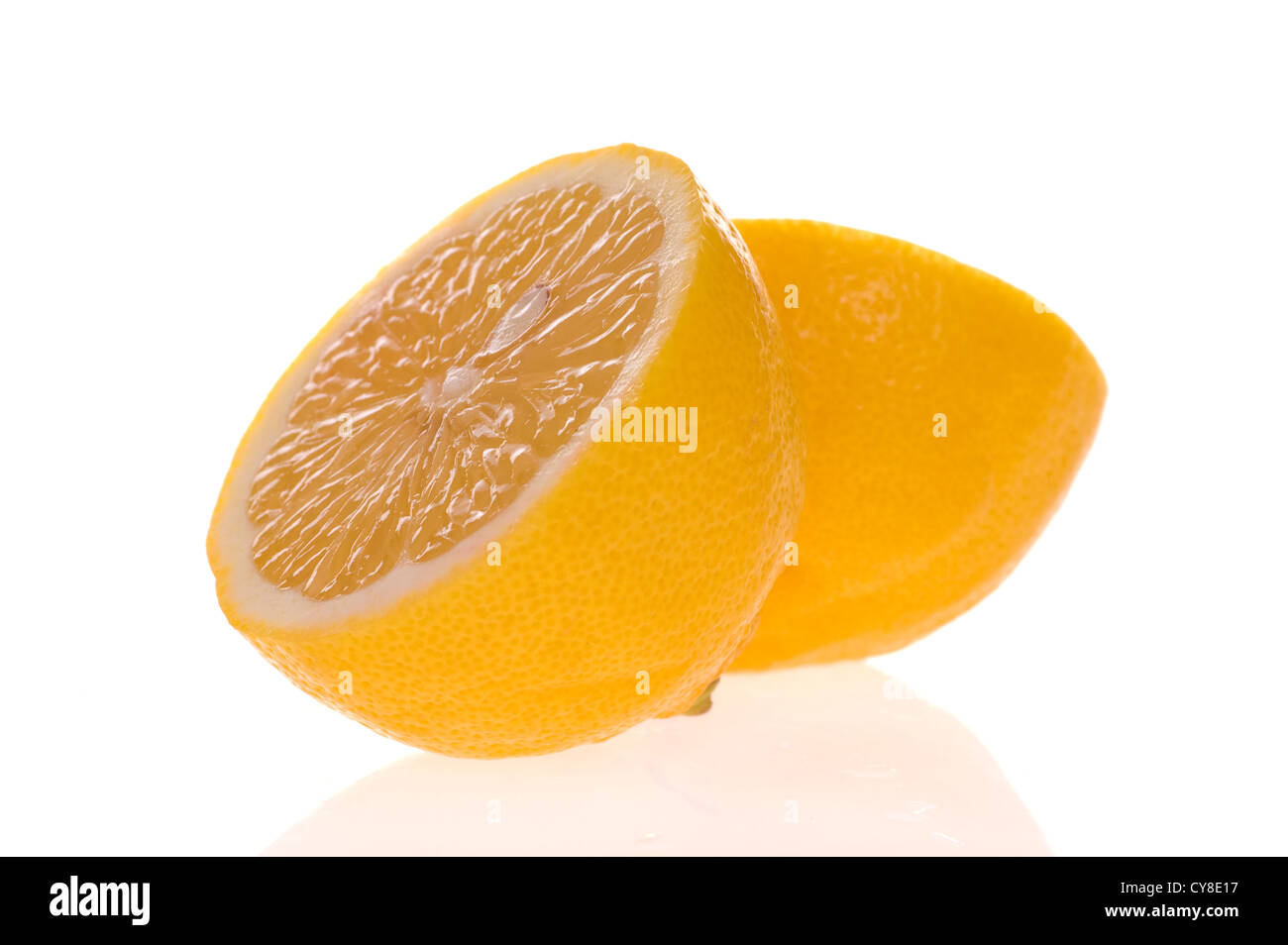 Lemon cut in two halves photographed on a white background Stock Photo ...