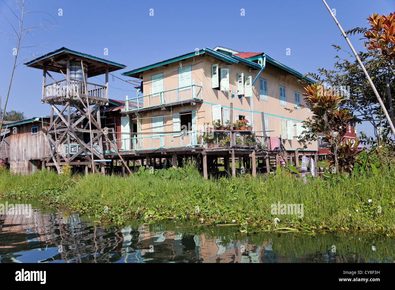 Myanmar, Burma. Houses on Stilts, Inle Lake Village, Shan State. Tank ...